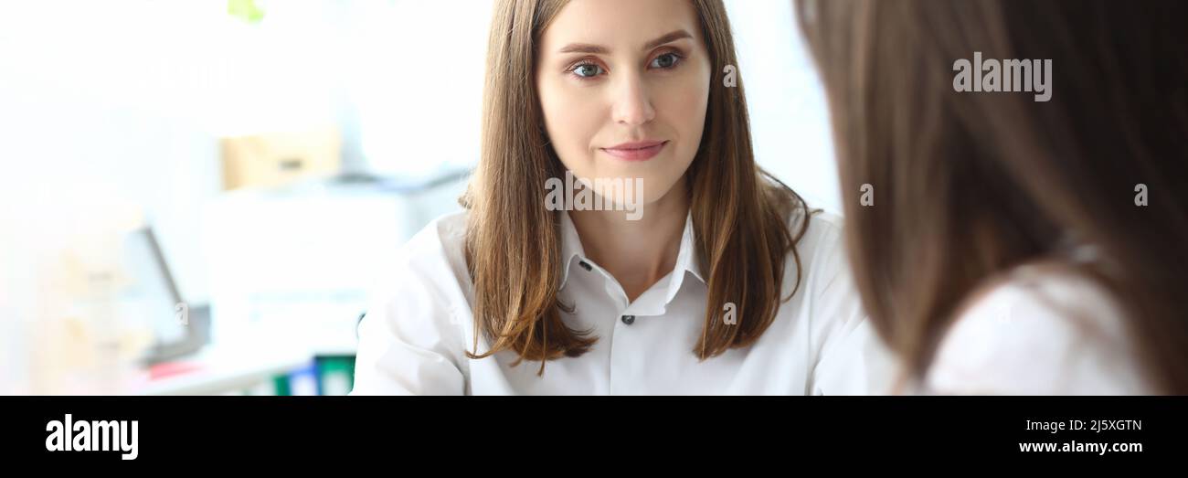 Pretty friendly lady sitting hi-res stock photography and images - Alamy