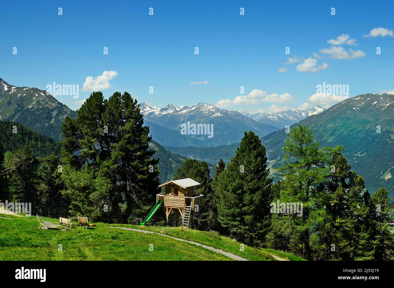 Austria, Tirol, children play ground with bench on Hochzeiger mountain ...