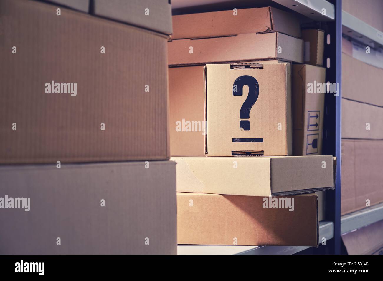 Question mark on a cardboard box, marking. Problems with labeling boxes ...