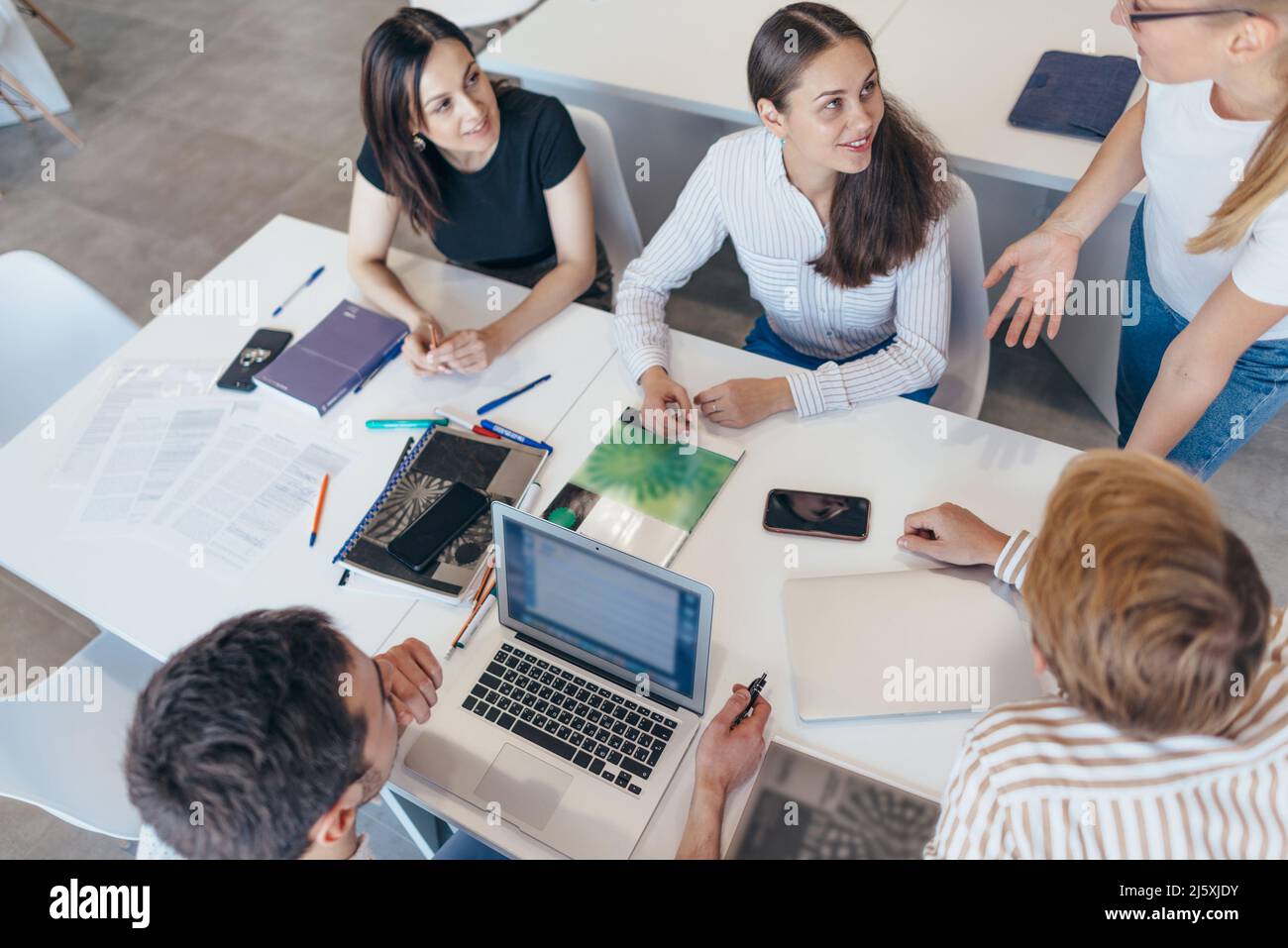 Business team talking around desk hi-res stock photography and images ...
