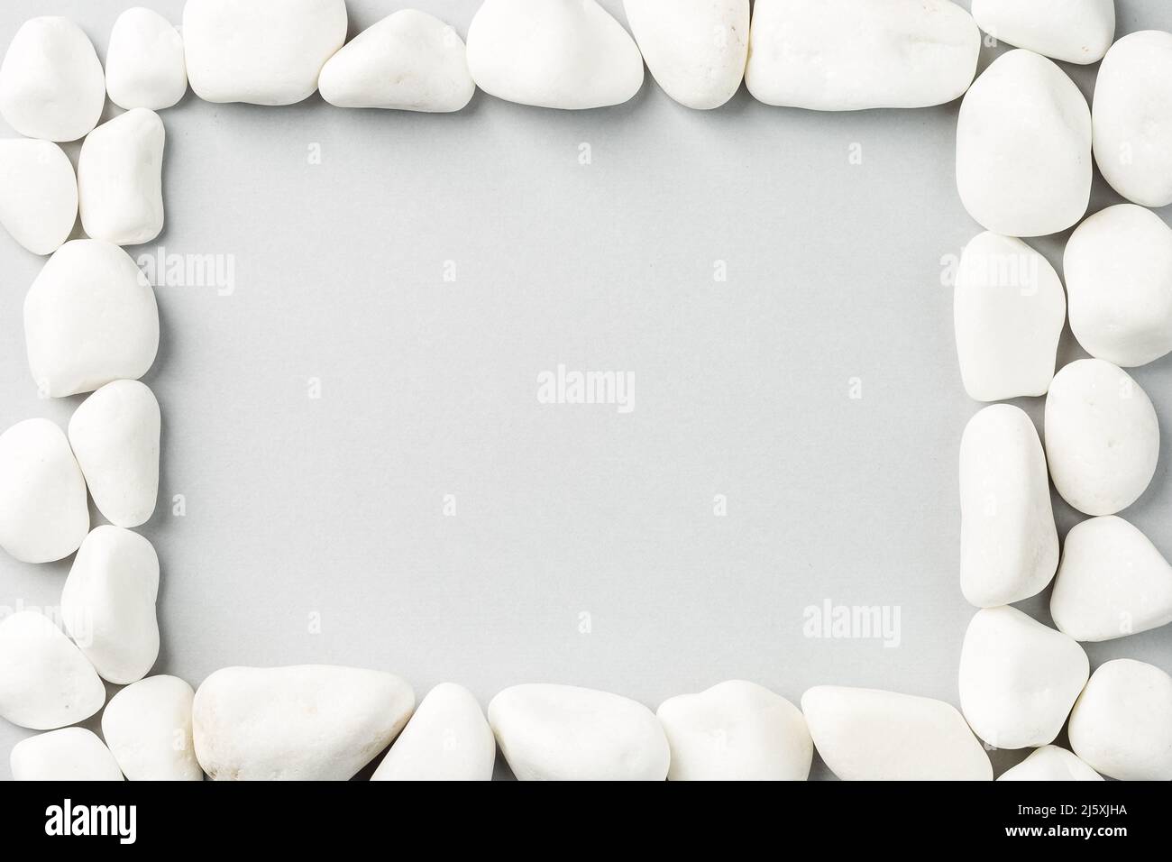 White stone frame on the grey background. Rock border Stock Photo - Alamy