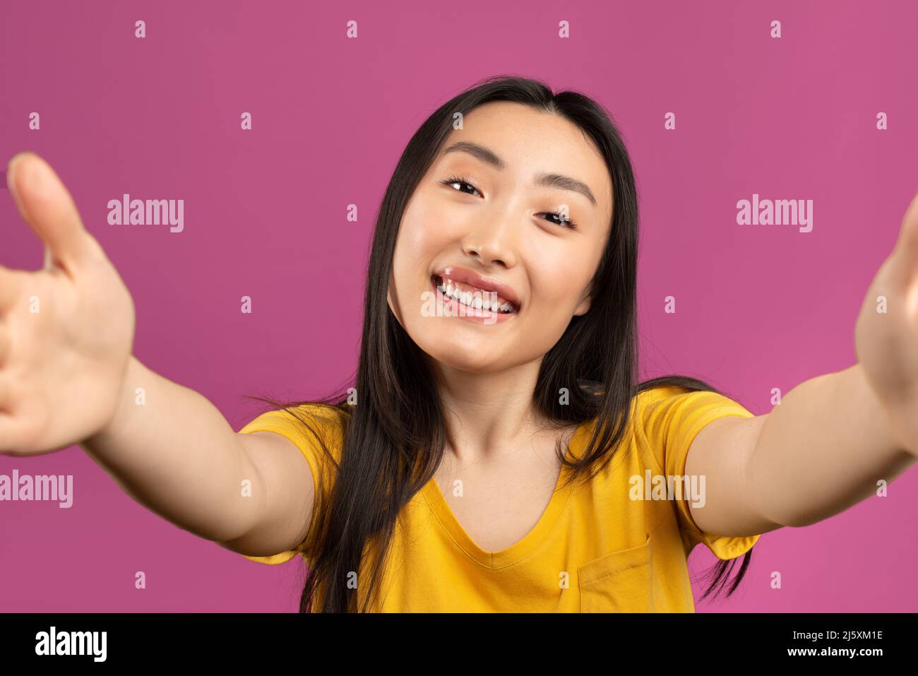 Korean blogger lady making selfie and smiling, posing to camera in ...