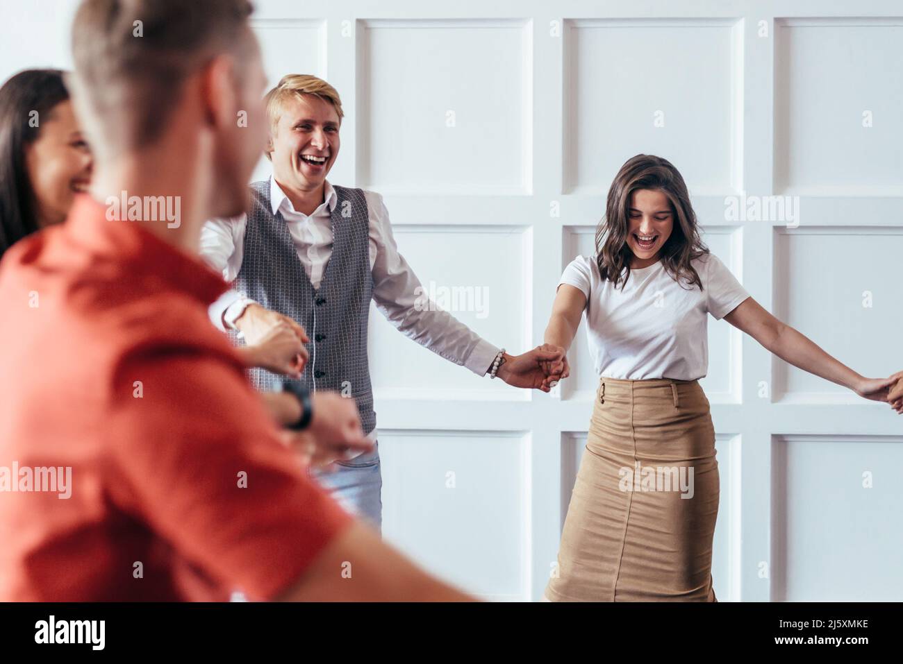 People walk in a circle holding hands Stock Photo - Alamy