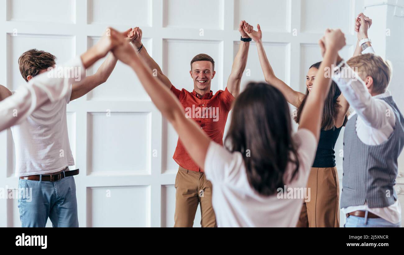 People hold hands, play and have fun Stock Photo - Alamy