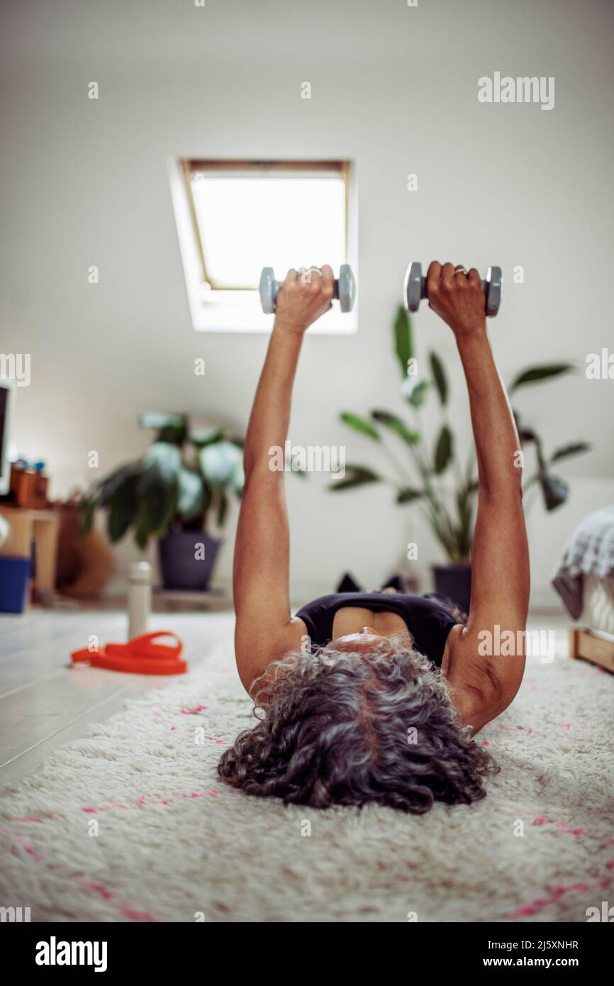 Woman home laying on rug hi-res stock photography and images - Alamy