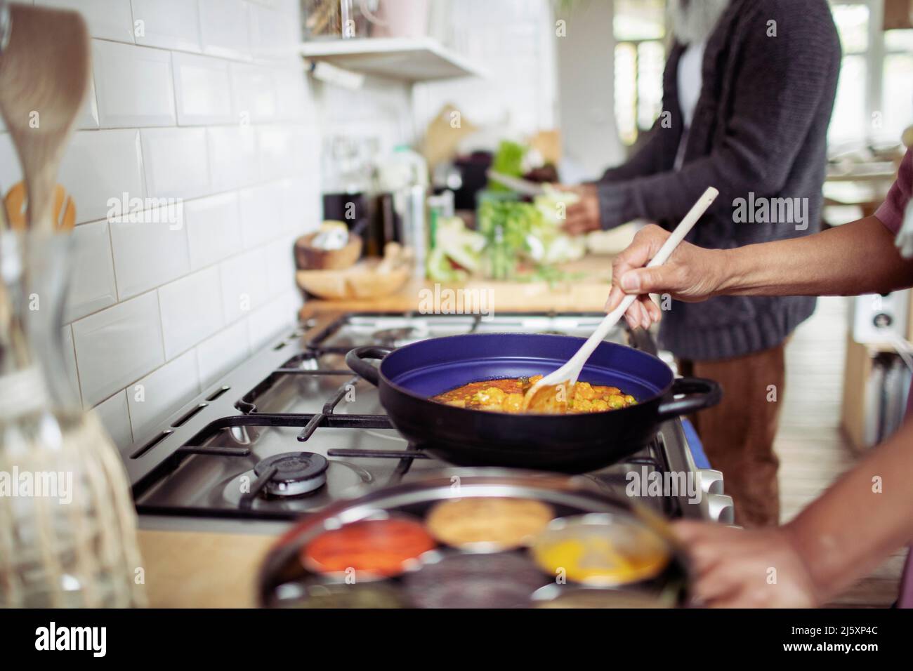 Indian couple cooking kitchen hi-res stock photography and images - Alamy