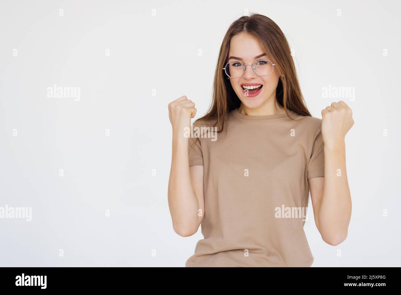 Portrait of a excited woman with positive emotions - on white ...