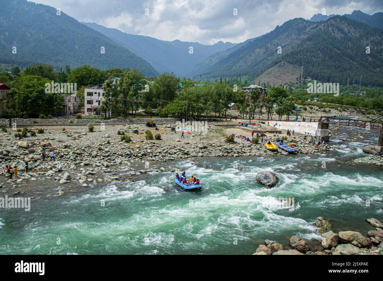 Srinagar, India. 24th Apr, 2022. Indian tourists are seen rafting in a ...