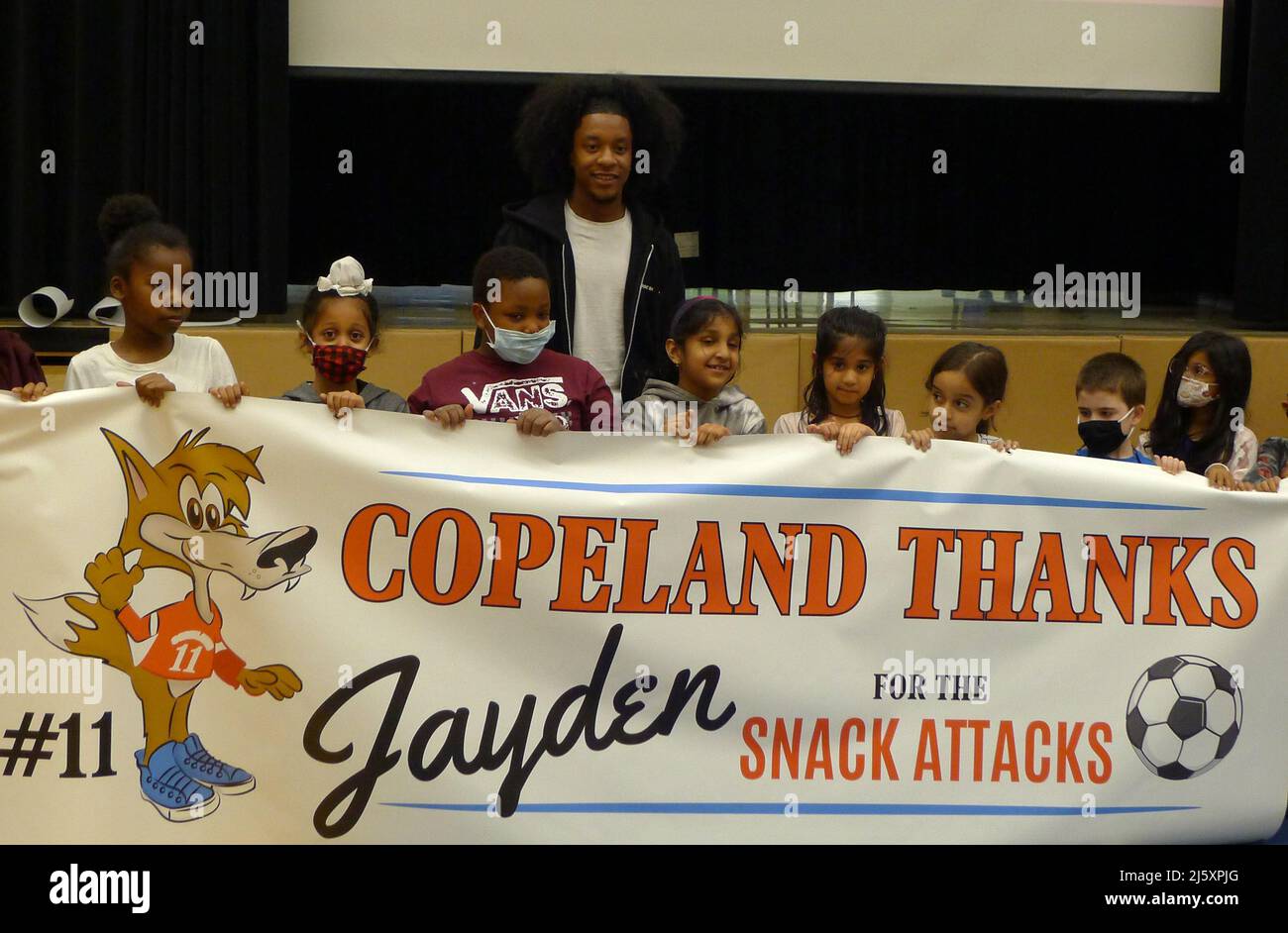 Jayden Nelson poses with kids from Copeland Public School, where he is ...