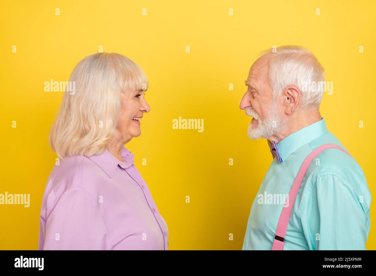 Profile side view portrait of two attractive grey-haired people ...