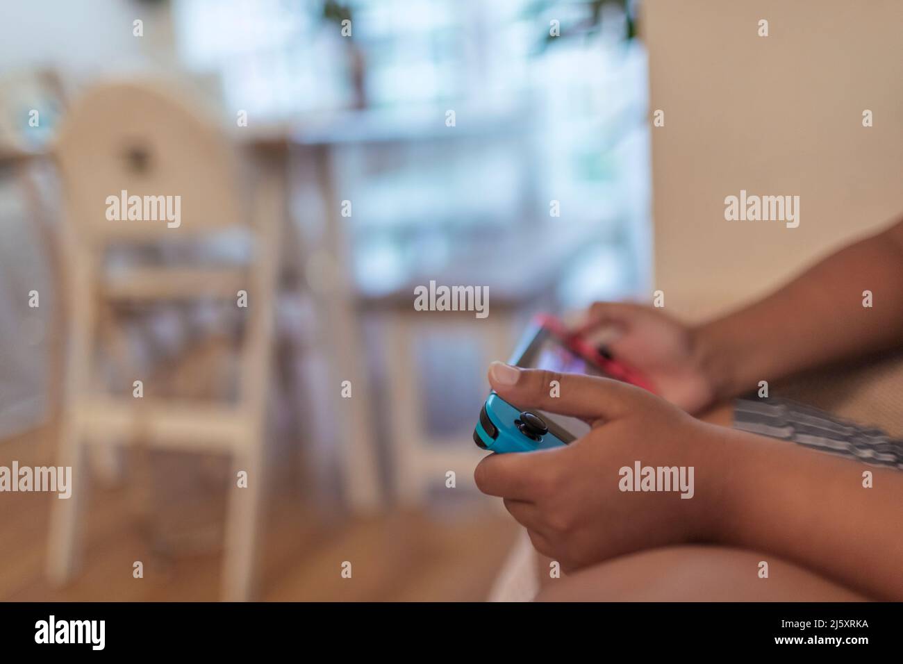 Boy sitting playing game on hi-res stock photography and images - Alamy