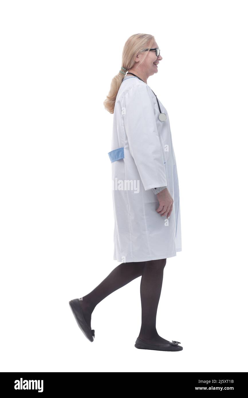 side view. experienced female doctor stepping forward. isolated on a ...