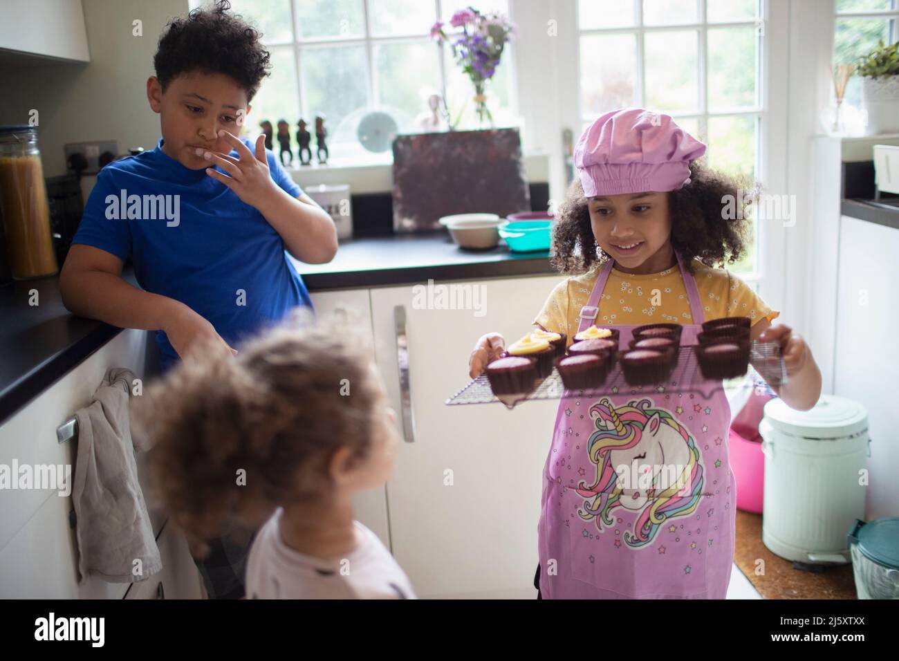 Kids baking cupcakes in kitchen Stock Photo - Alamy