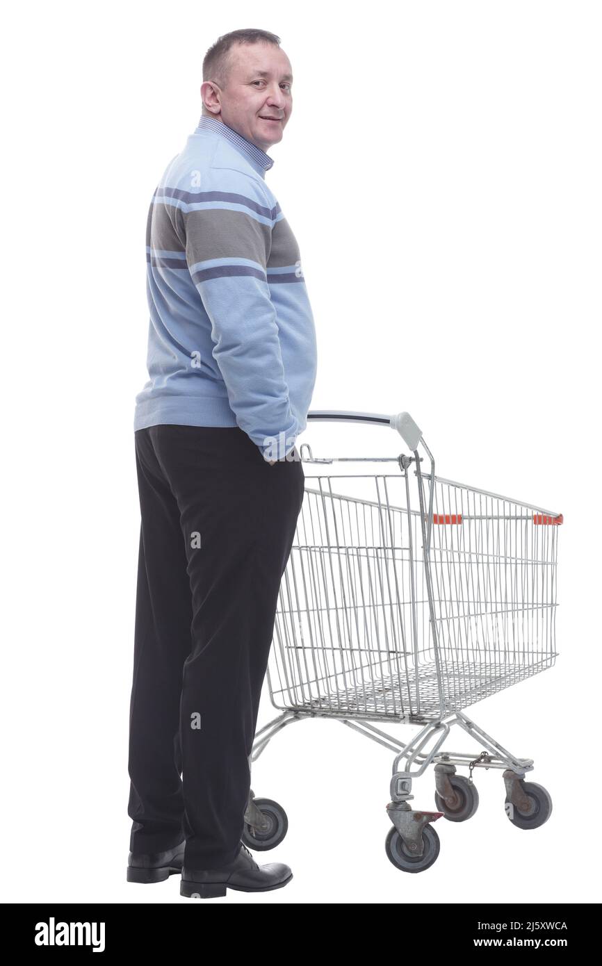 rear view. casual man with a cart standing in front of a white screen ...