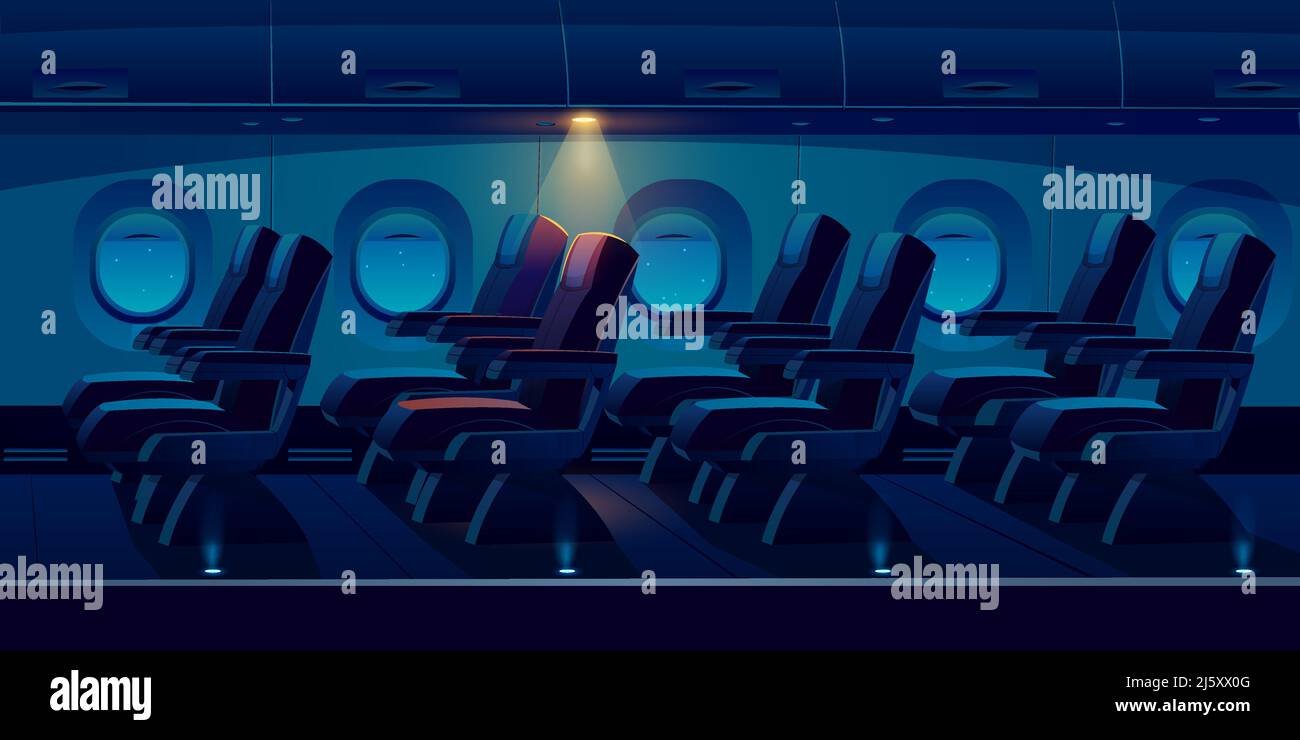 Airplane cabin at night time, dark plane economy class cockpit with ...