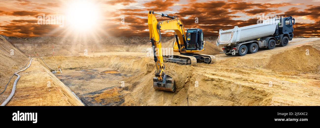 excavator digging on construction site Stock Photo - Alamy