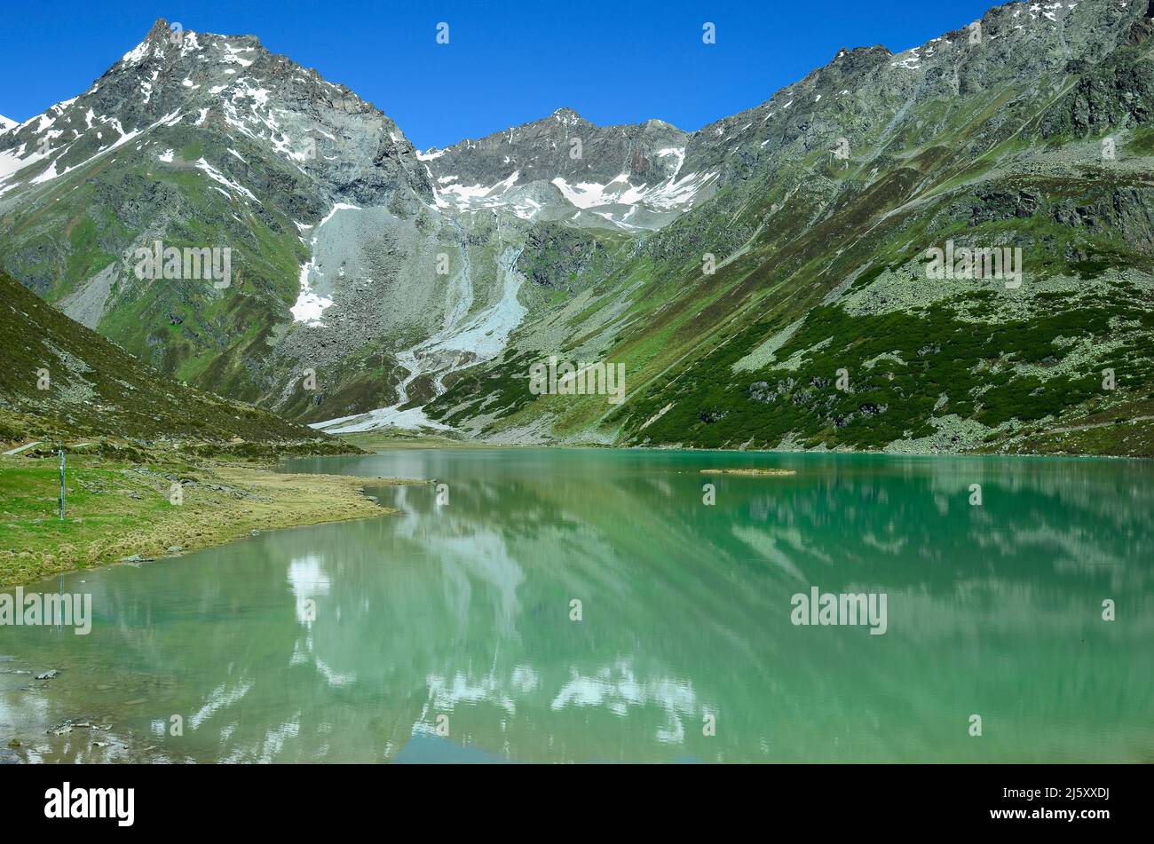 Austria, Tirol, reflection of Tyrolean Alps in Riffllsee lake in ...