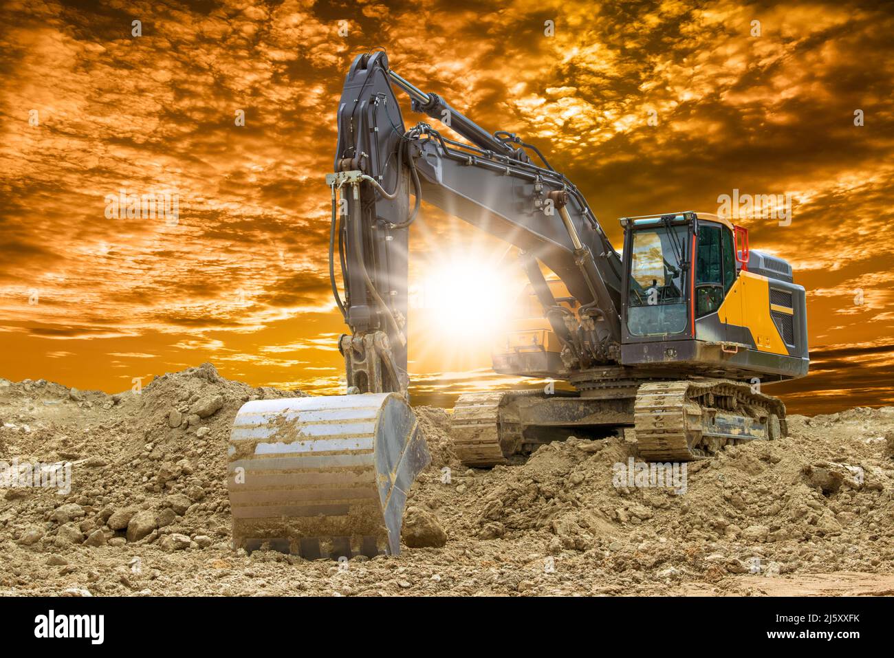 excavator digging on construction site Stock Photo - Alamy