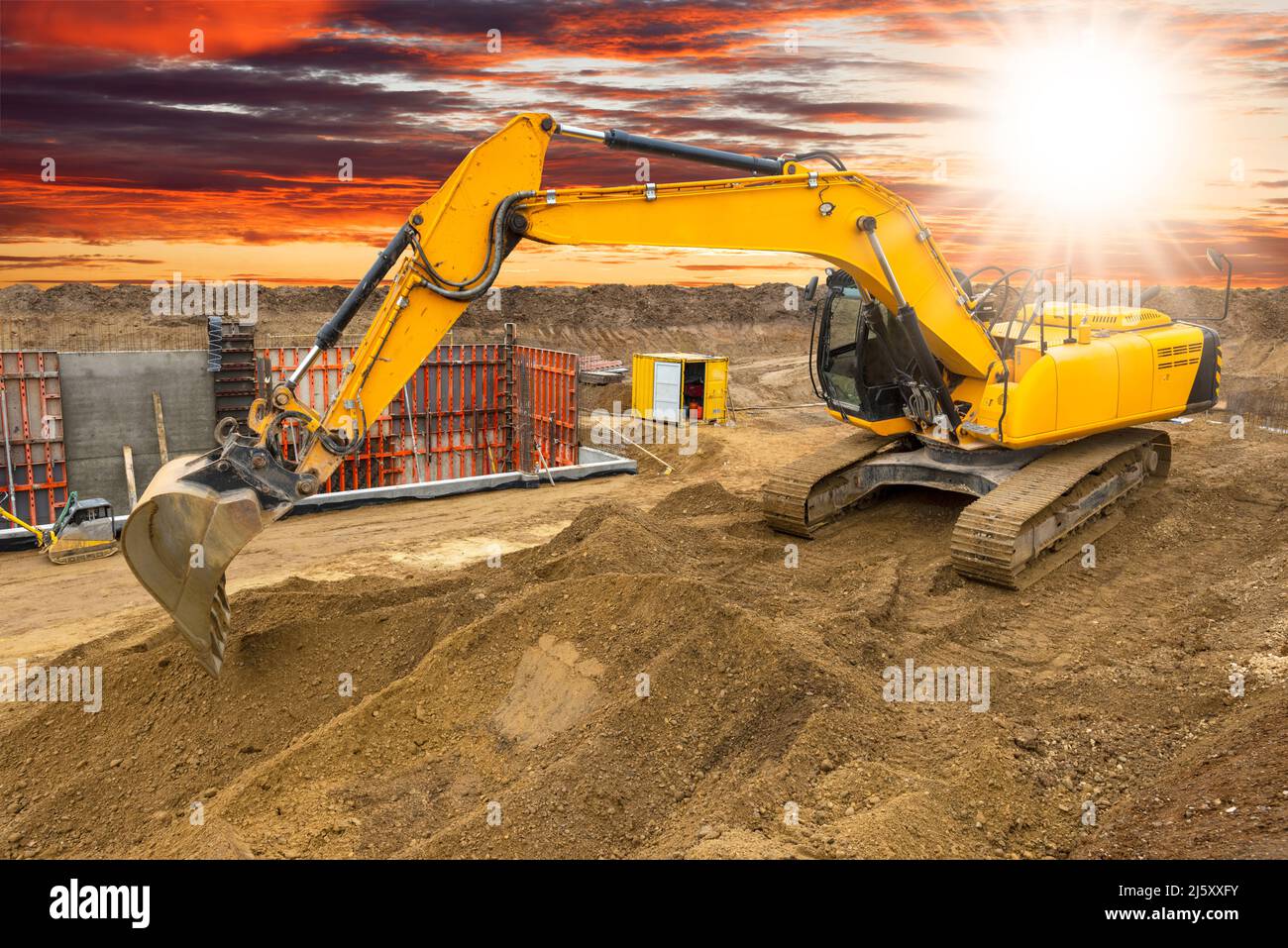 excavator digging on construction site Stock Photo - Alamy