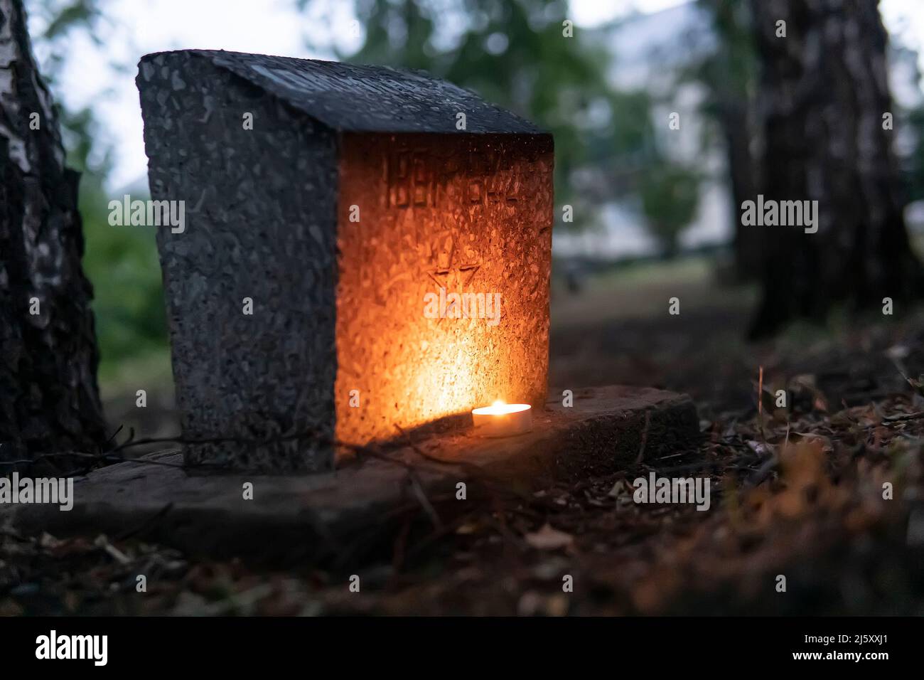 A candle near the monument to fallen soldier during the Great Patriotic ...