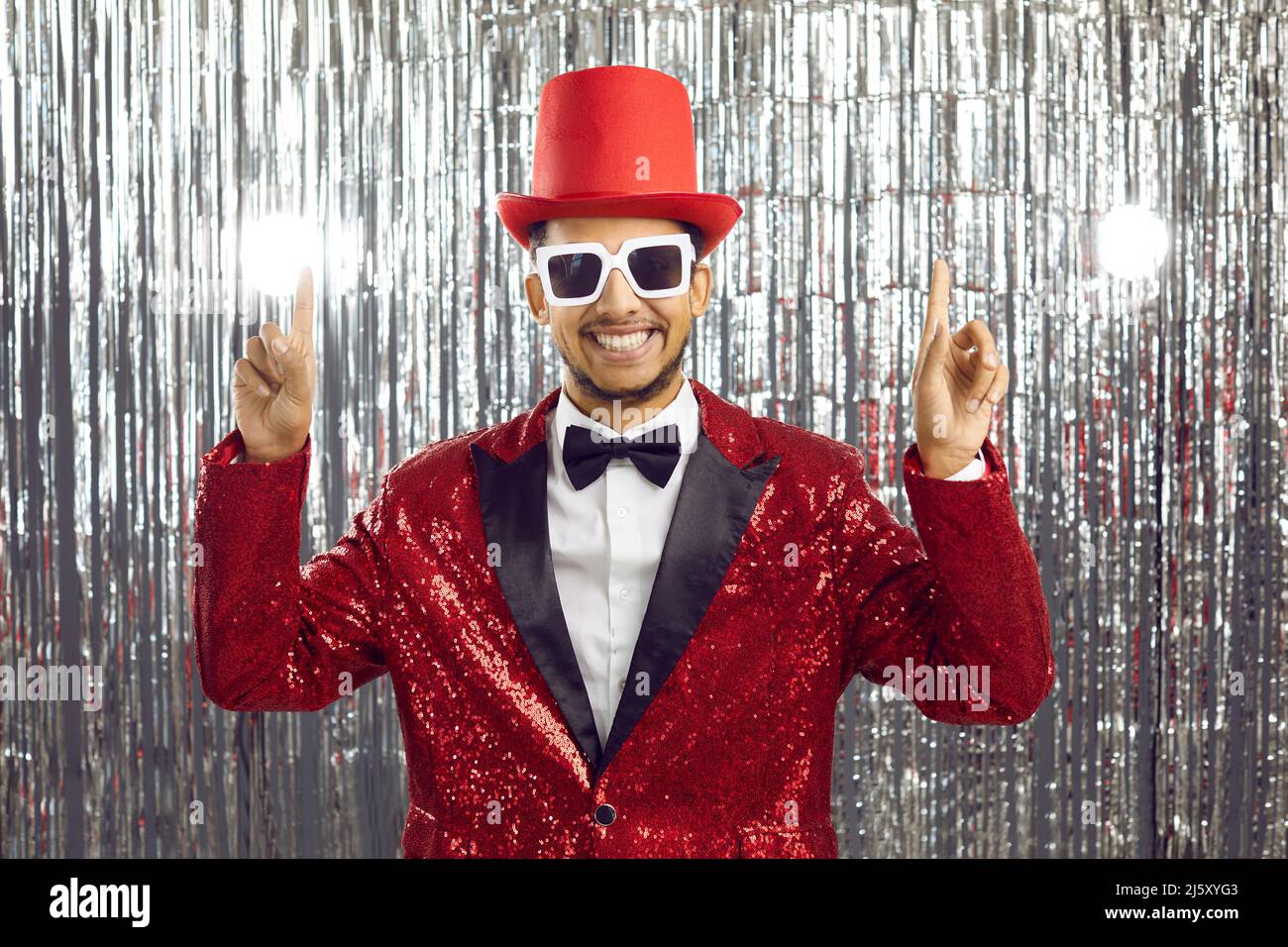 Portrait of happy disco man point up at deal Stock Photo - Alamy