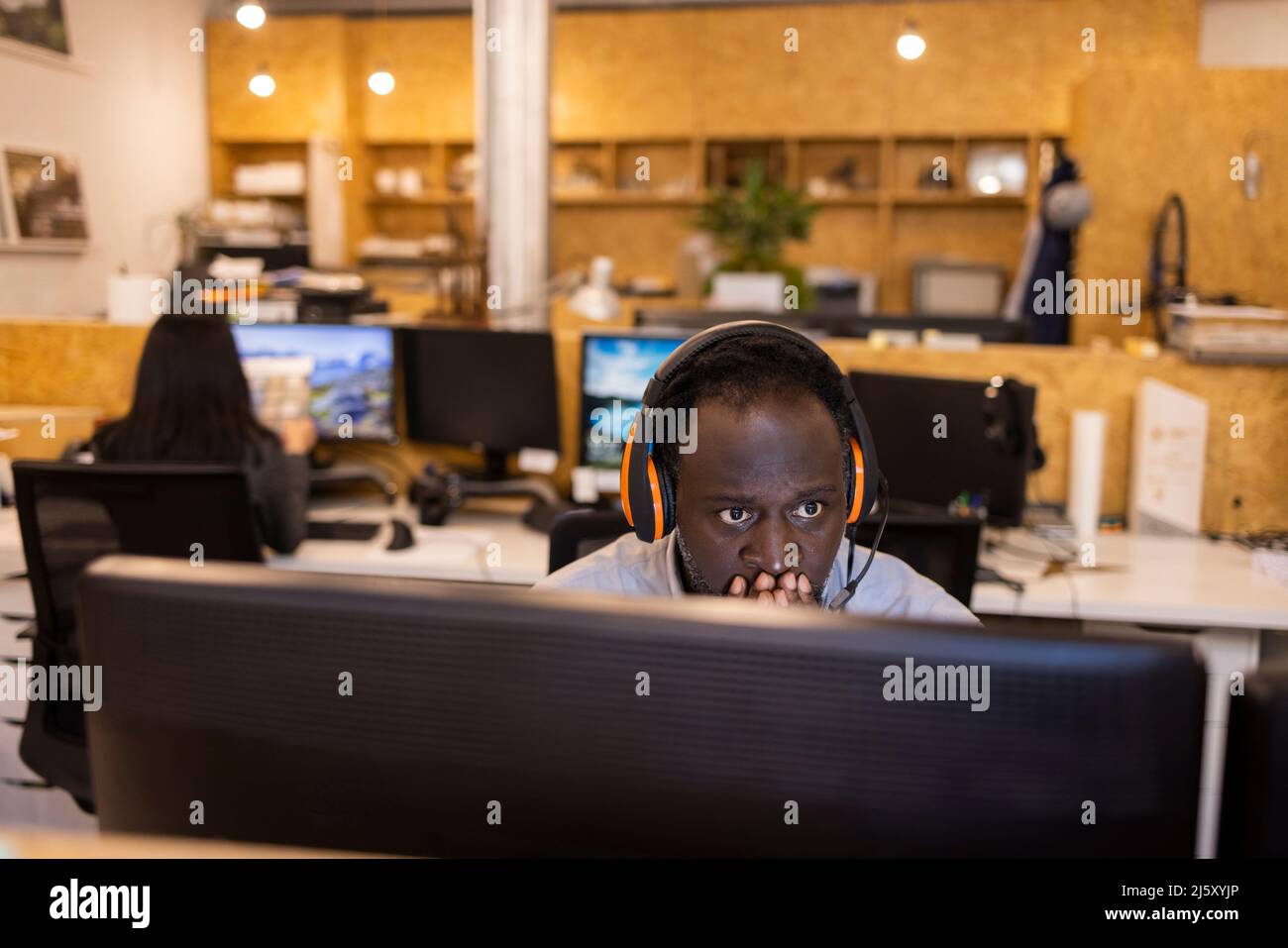 Focused businessman using computer in open plan office hi-res stock ...