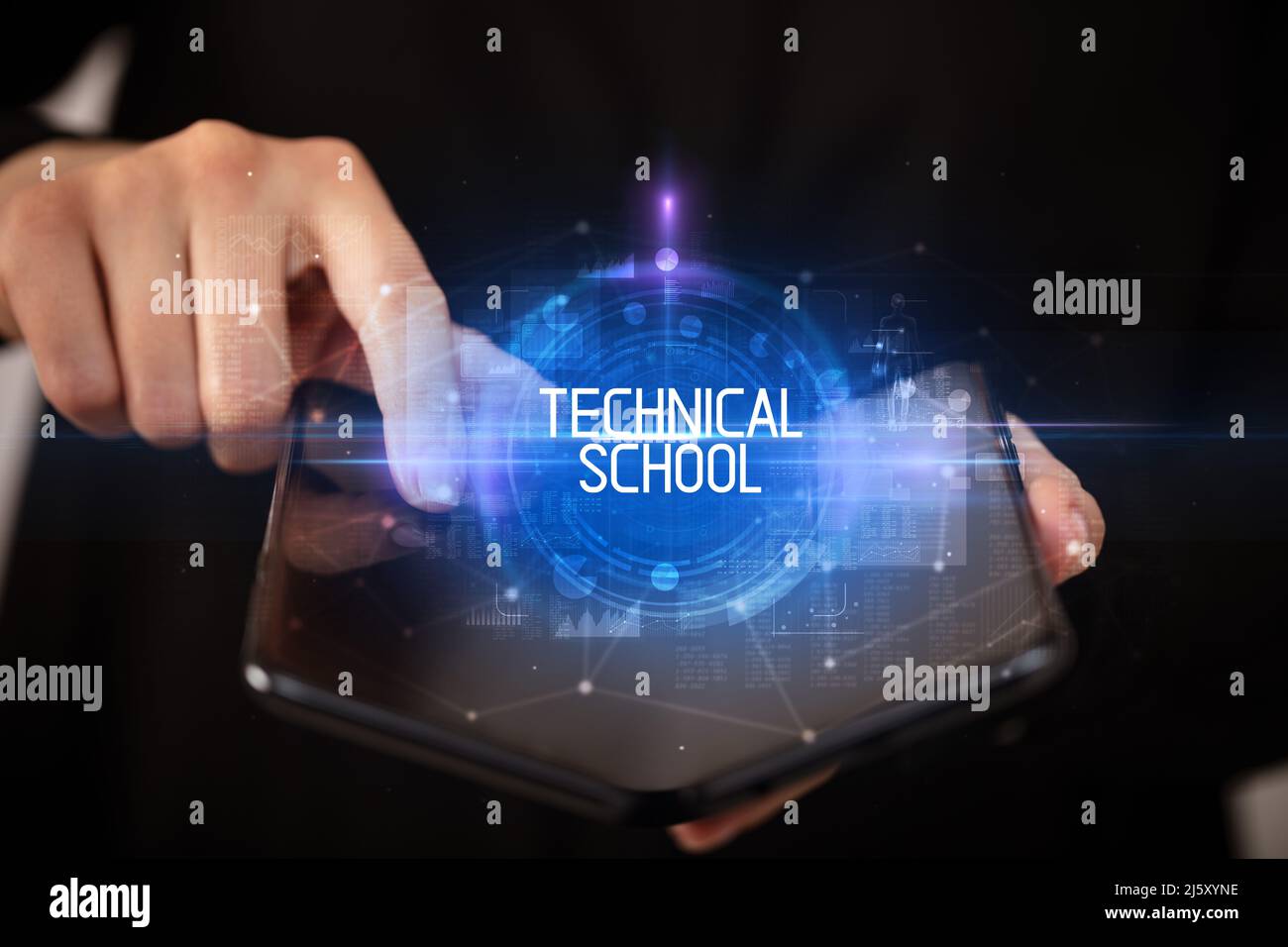 Young man holding a foldable smartphone Stock Photo - Alamy