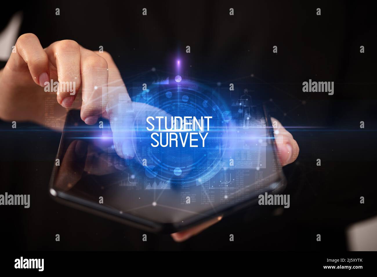 Young man holding a foldable smartphone Stock Photo - Alamy