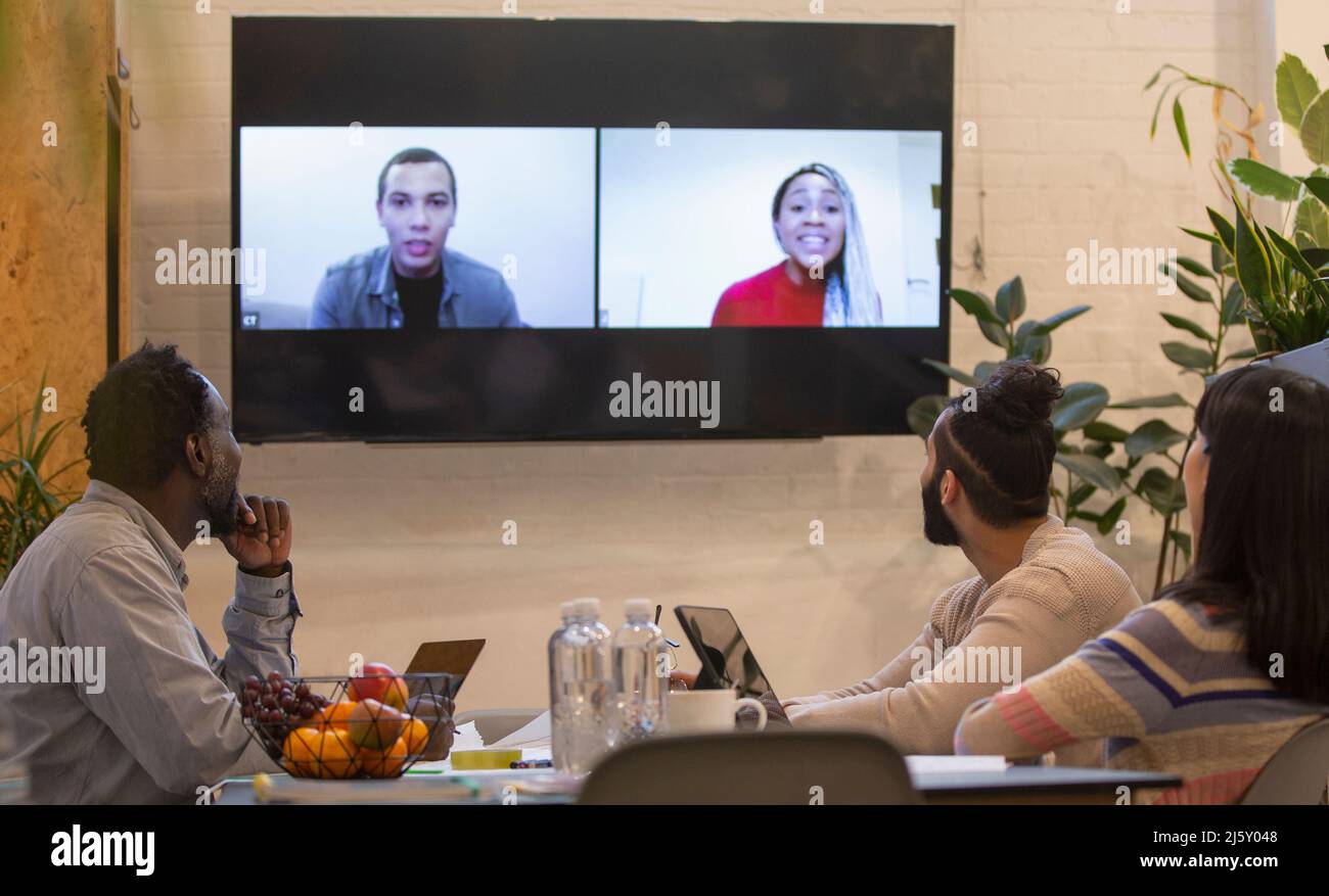 Business people video conferencing in office meeting Stock Photo - Alamy