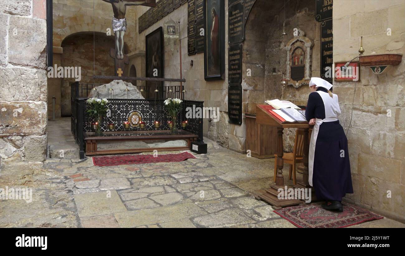 A Russian Orthodox nun prays at the basement where remnants of the ...