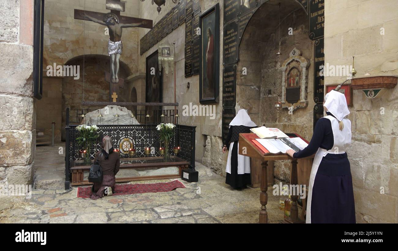 A Russian Orthodox nun prays at the basement where remnants of the ...