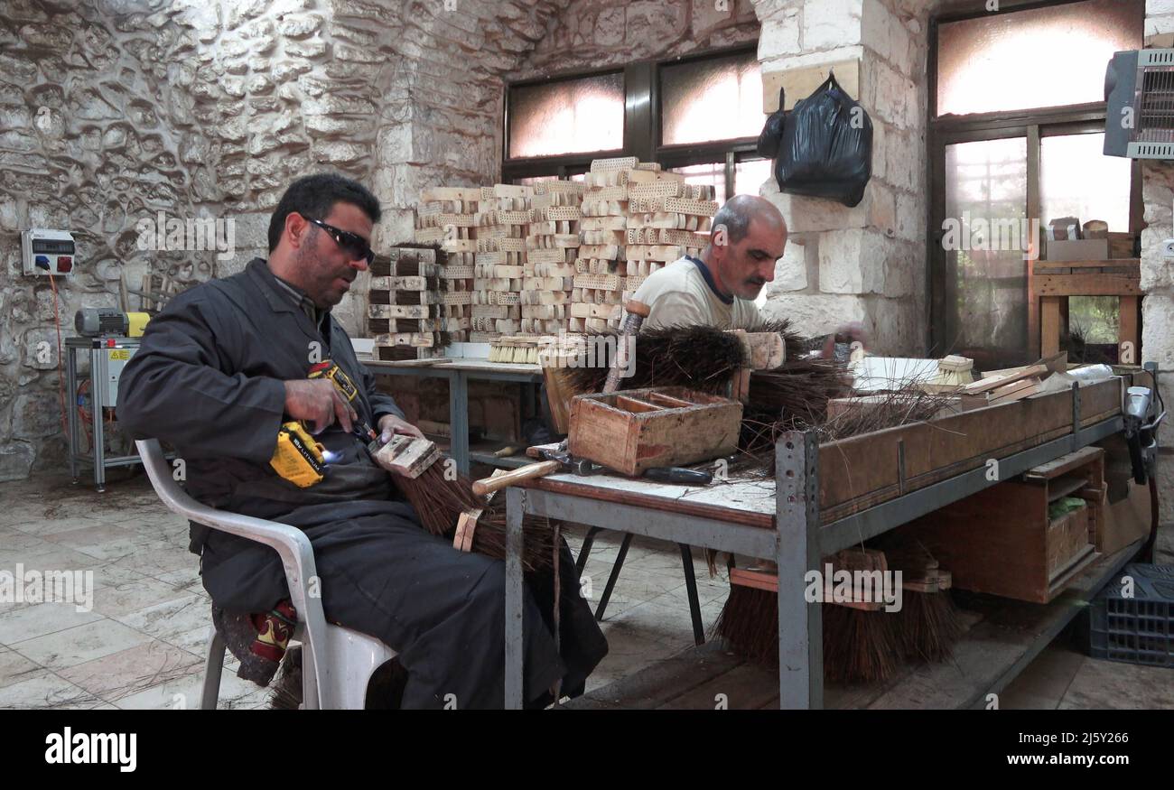 Blind Palestinian workers make brooms at the workshop owned and managed ...