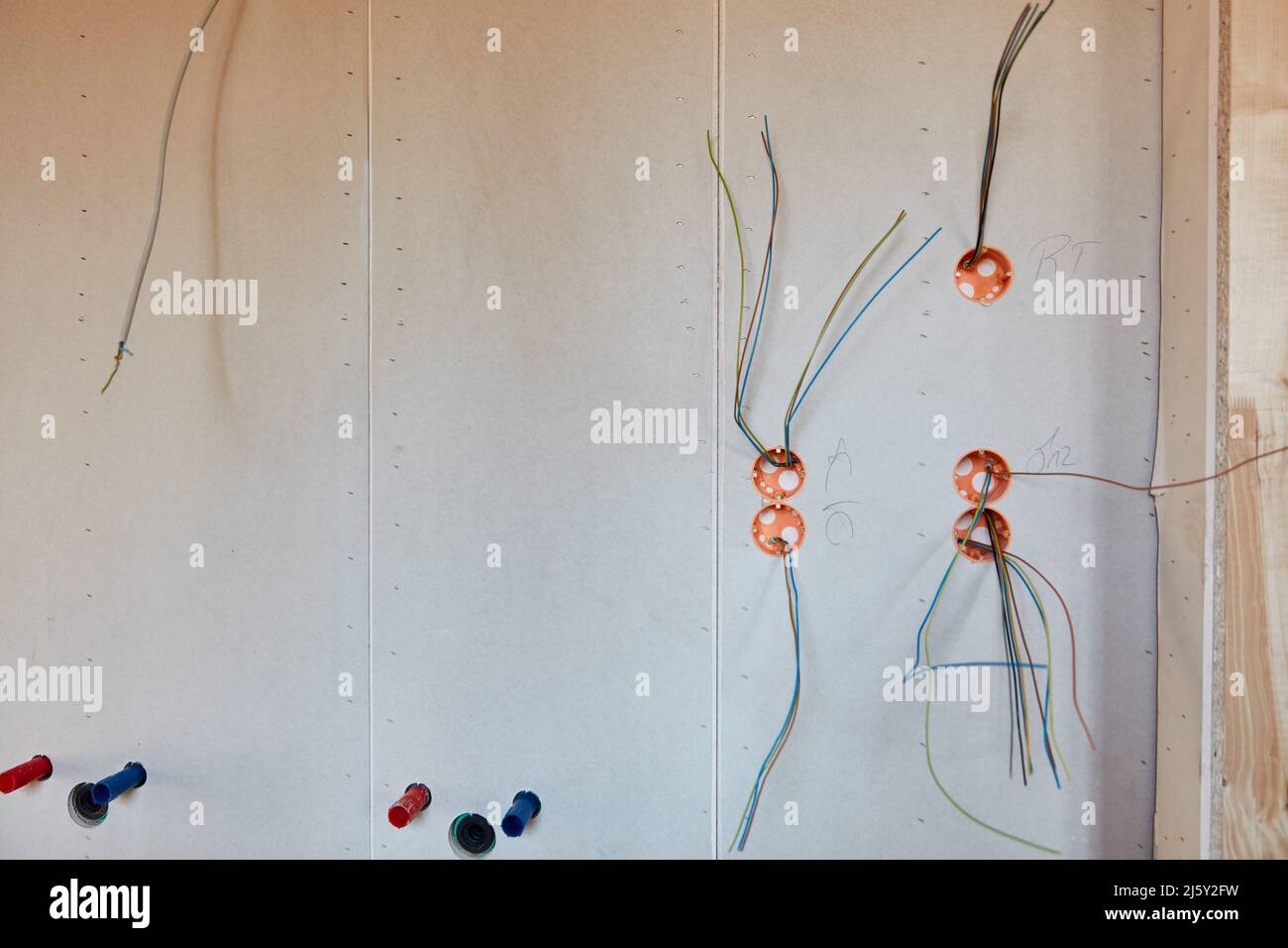 Plasterboard wall with cables for electrical installation in interior ...