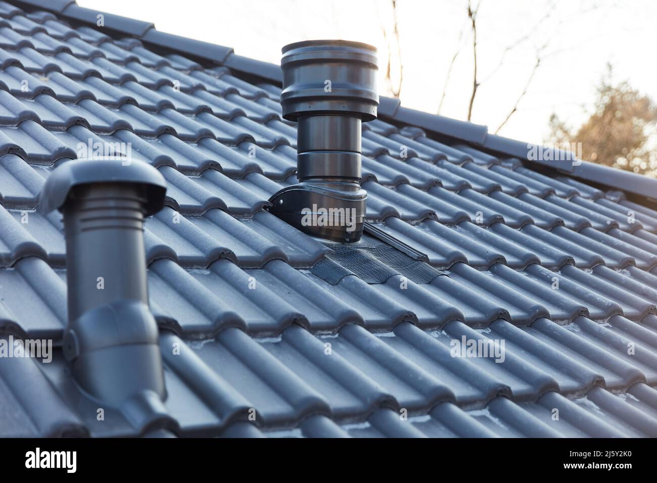 Ventilation pipe and small chimney on the roof of a new house Stock ...