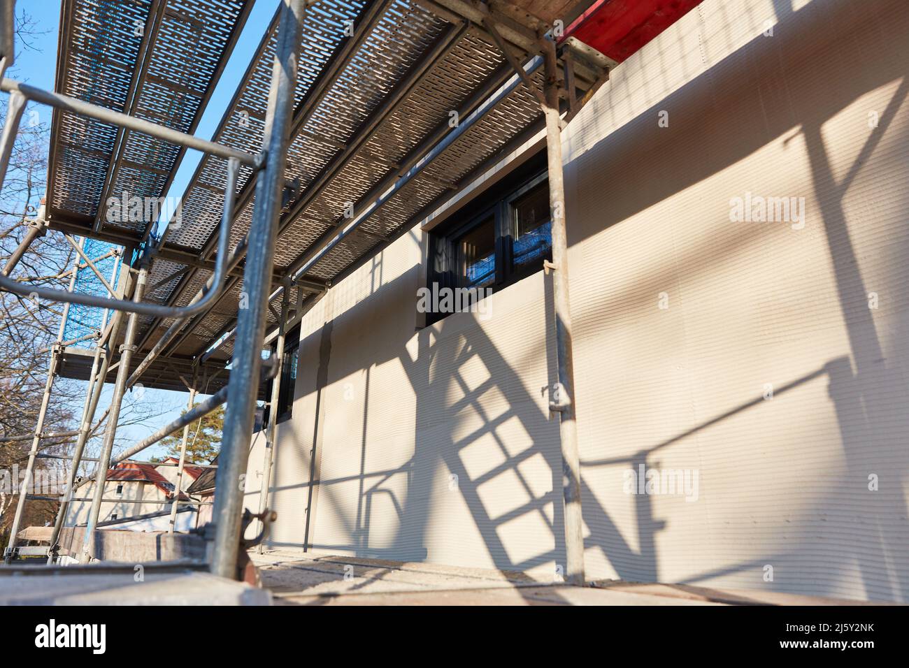 Scaffolding is at the house on the construction site for a new family ...