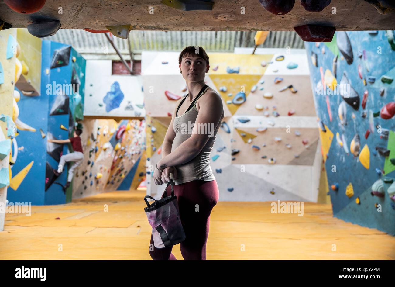 Person climbing over wall hi-res stock photography and images - Alamy