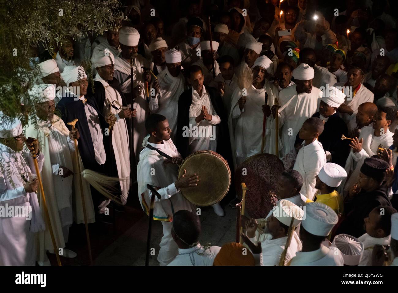 Ethiopian Orthodox Christians play the Kebero a double-headed, conical ...