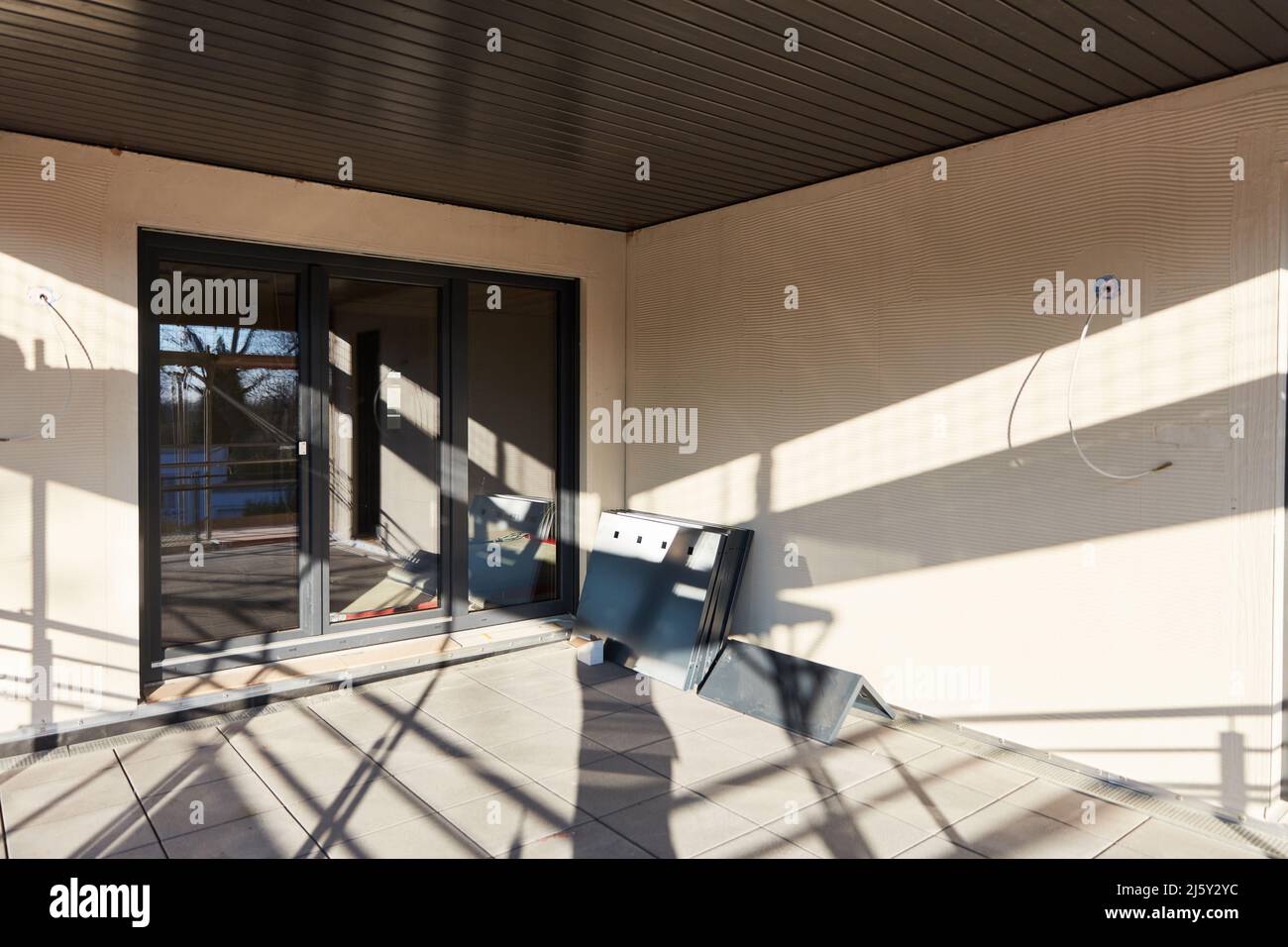 New construction of a terrace at the house with window and large patio ...