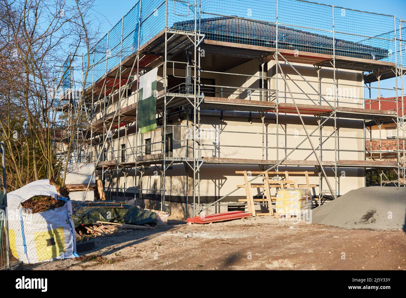 Scaffolding on the construction site of a house as a new building as an ...