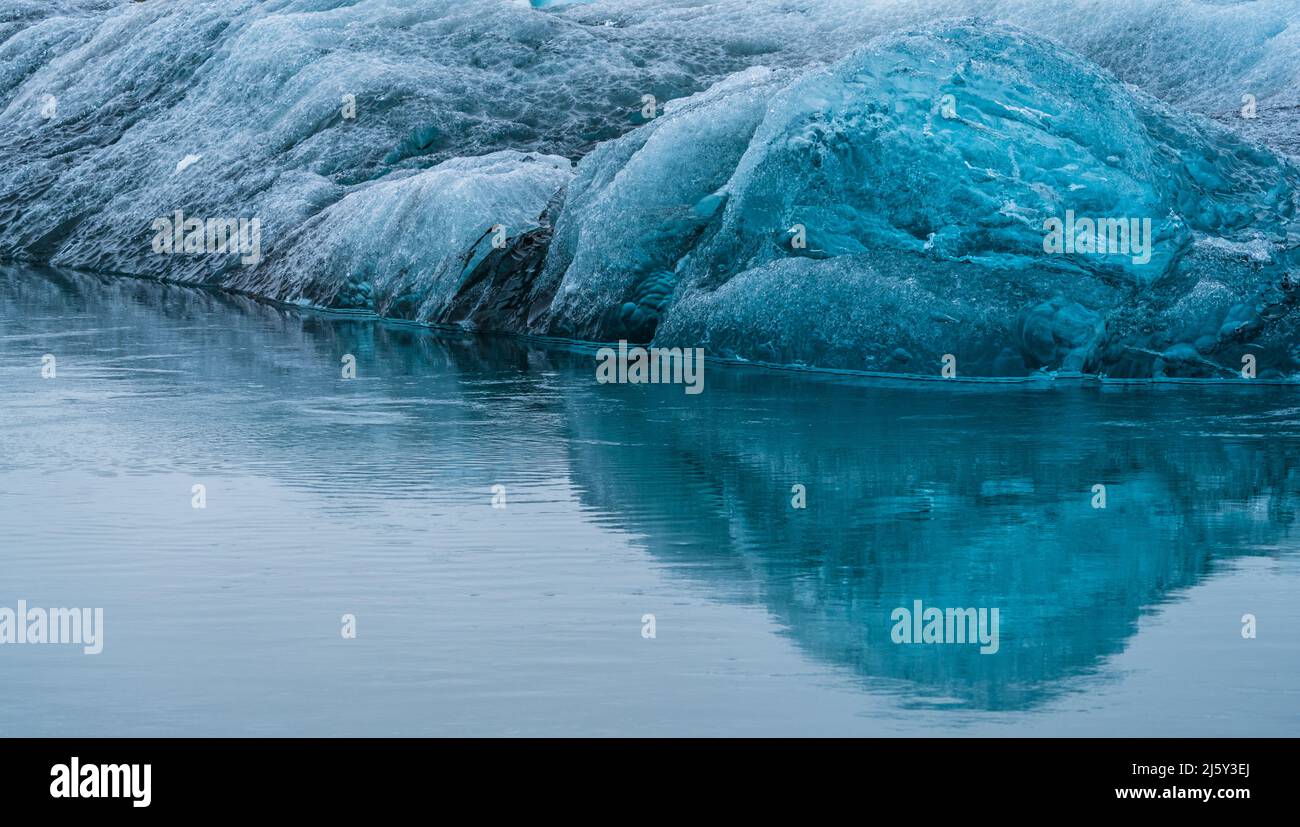 Background of glacier edge over the lake and water line Stock Photo - Alamy