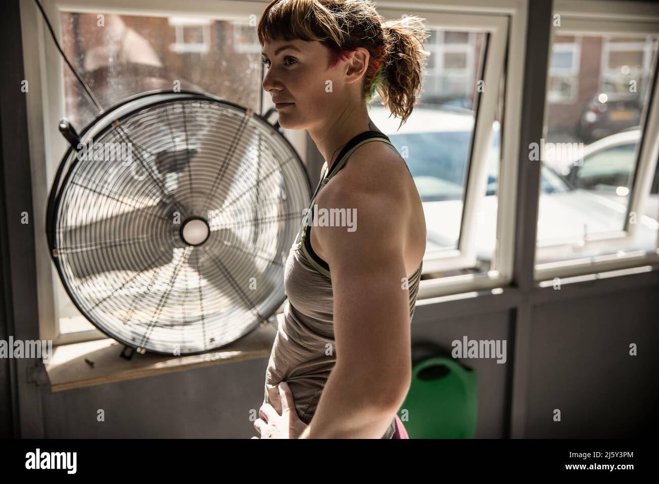 Woman standing with fan hi-res stock photography and images - Alamy