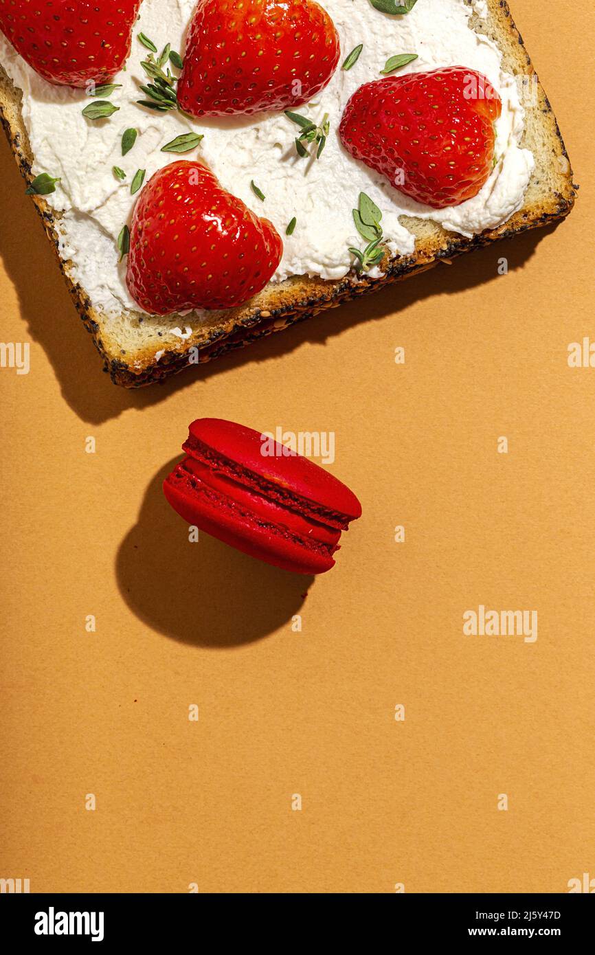 Top view of tasty toasts with cream cheese and ripe strawberries ...