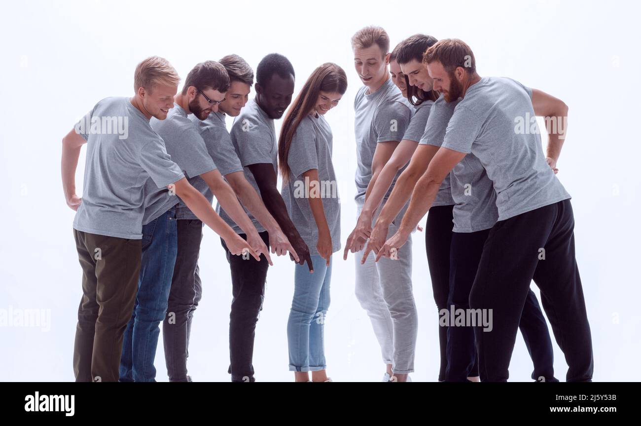 in full growth. group of young people pointing at one point. isolated ...