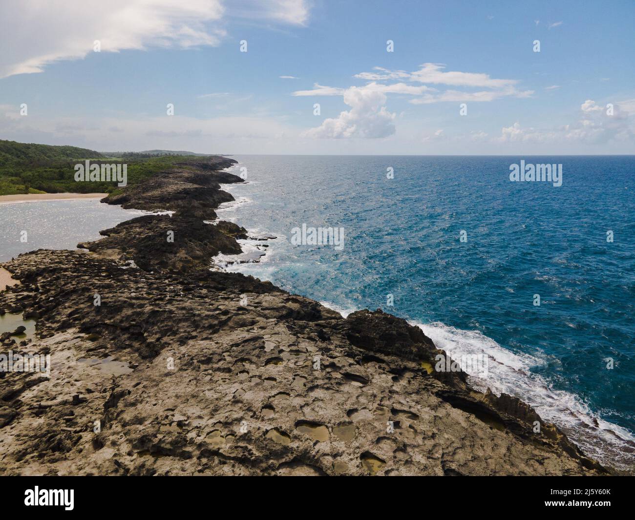 Rocky coast of manati in endless blue Atlantic Ocean in Playa Mar ...