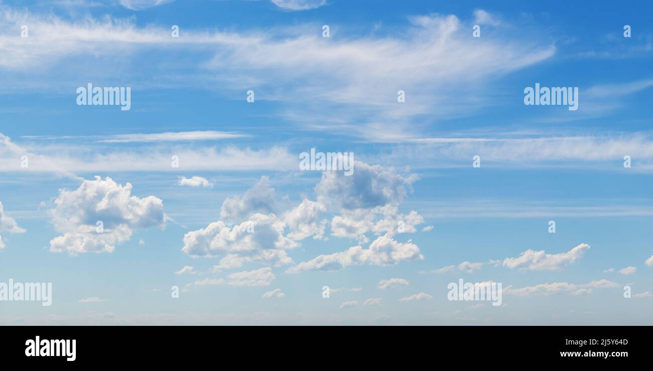 Blue sky with different types of clouds. Panoramic background photo ...