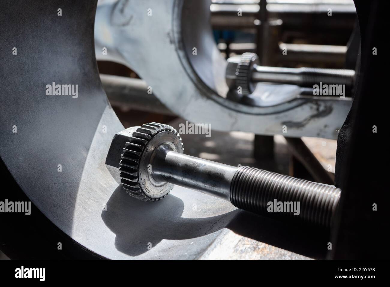 Close up of the CNC lathe jaw clamping raw material steel rod .Steel ...