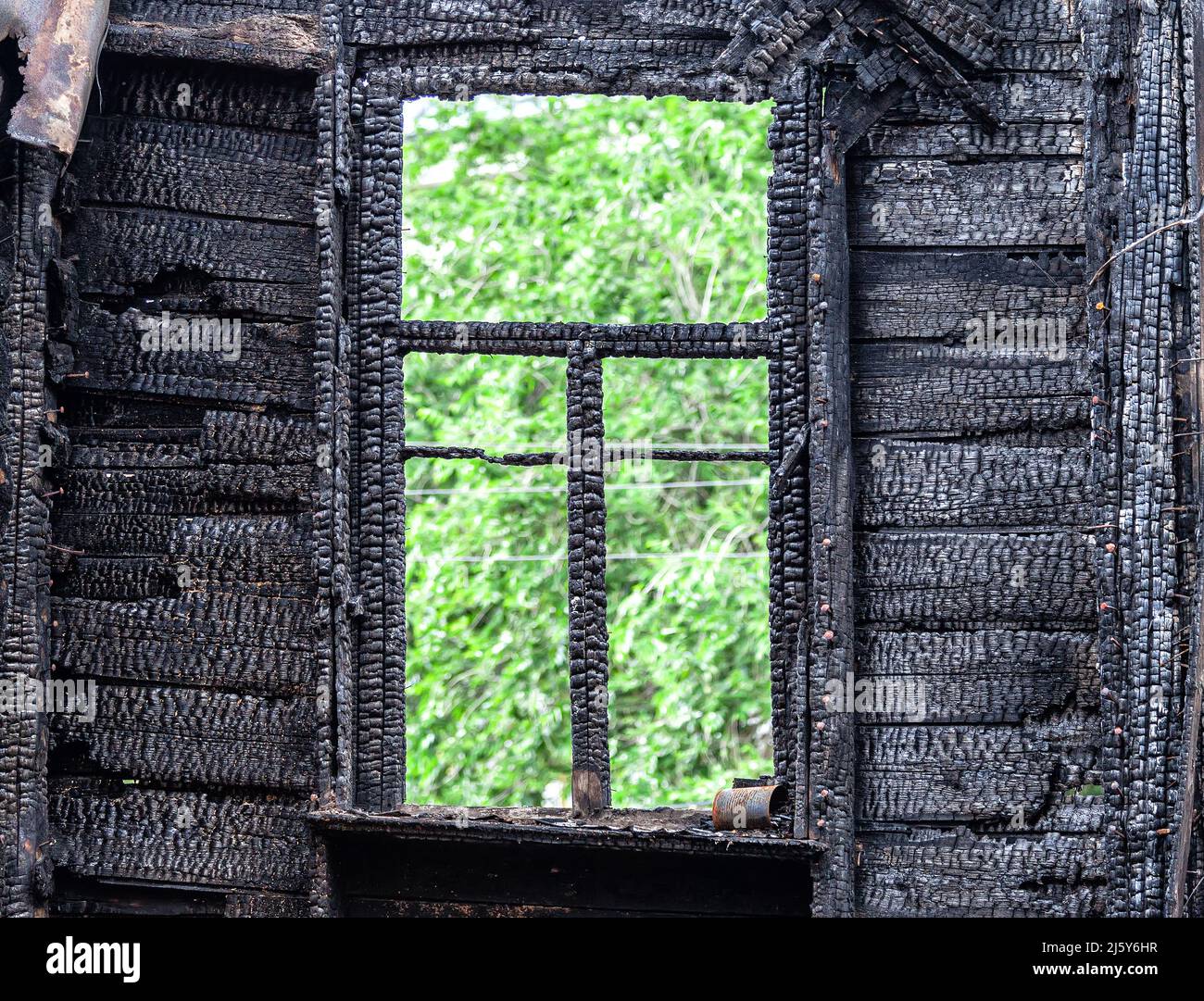 Charred wooden window frame of a burned down house Stock Photo - Alamy