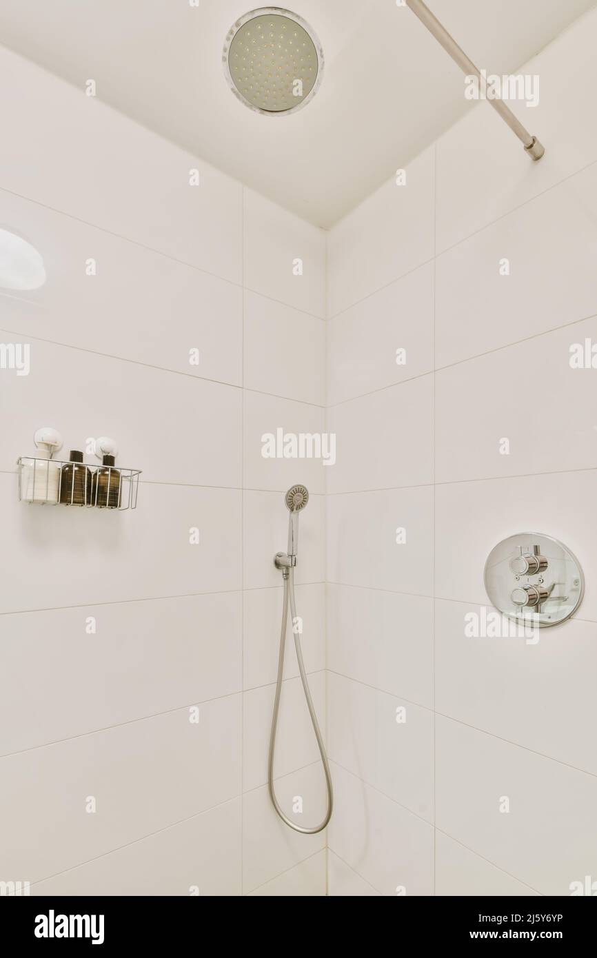 Light empty shower cabin with metal set in modern bathroom with white ...
