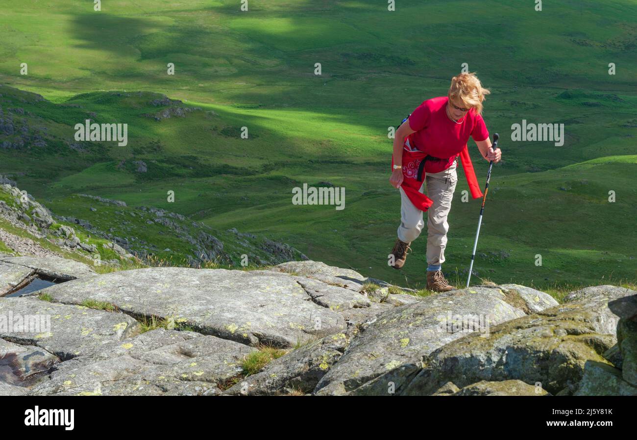 A hillwalker arriving at White Pike in the Ulpha Fells of Western ...