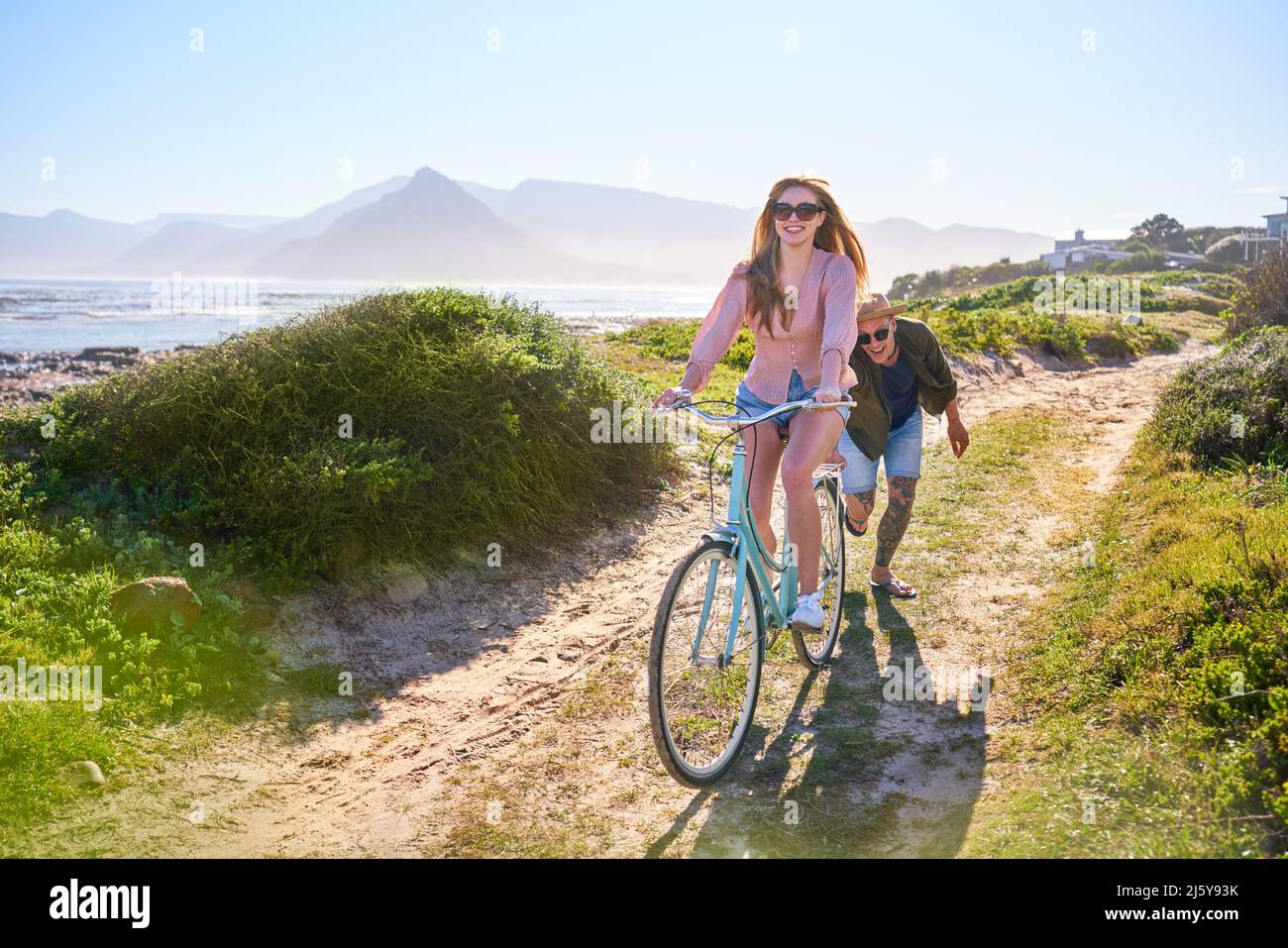 Riding bike on beach hi-res stock photography and images - Alamy